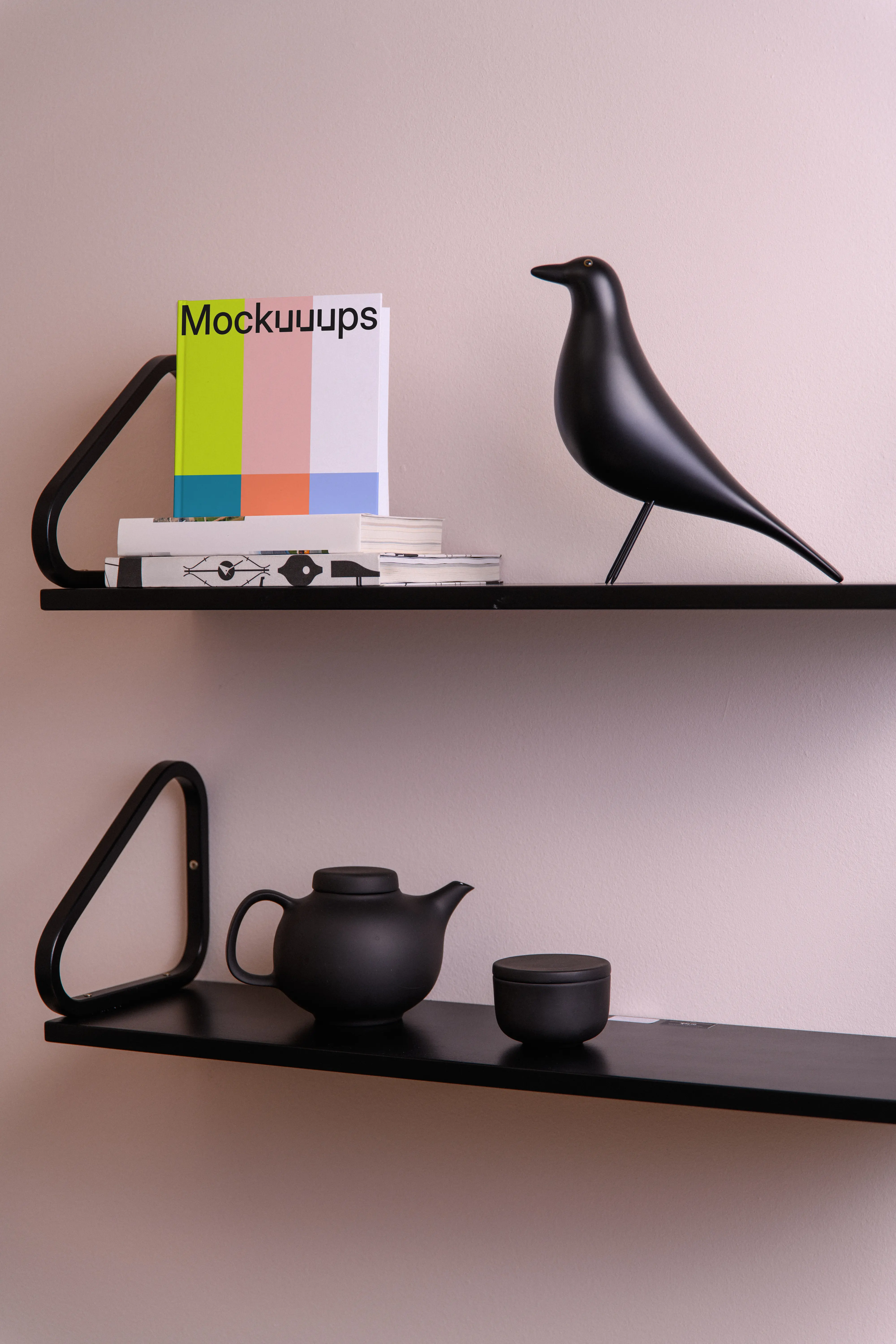 Mockup of a square book on modern shelves with ceramic decor ...